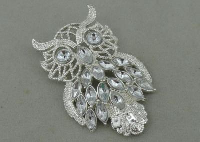 China UHU Souvenir Badges By Pewter Die Casting , 3D Design with Rhinestone And Silver Plating for sale