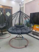China Modern Outdoor Rattan Wicker Double Seat Hanging Egg Patio Swing Chair with Metal Stand for sale