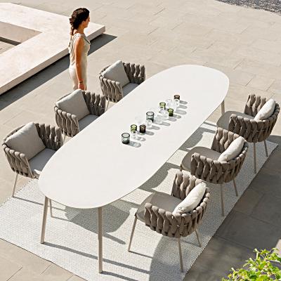 China Courtyard Rope Furniture Modern Design Outdoor Dining Set with Garden Table and Chairs for sale