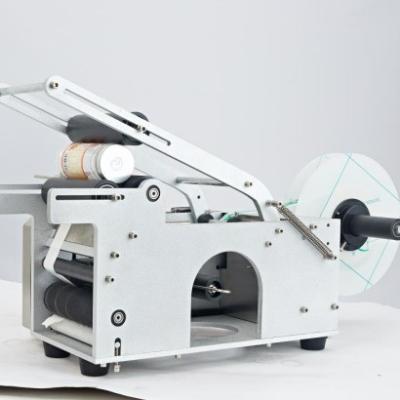 China DUOQI MT-50 Manual Round Bottle Label Applicator 150mm Diameter 20-40 pcs/min Labeling Speed for sale