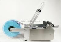 China MT-50 Manual Wine Bottle Labeling Machine 120W 20-40pcs/min for 10-150mm Bottles for sale