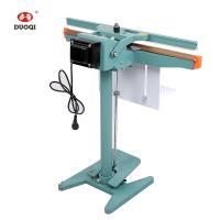 China DUOQI PFS-650x1 Aluminum Frame Foot Pedal Sealing Machine 650mm 1800W for Food Industry for sale