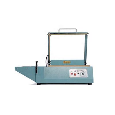 China DUOQI 380L Industrial L Bar Shrink Wrap Machine 220V 1KW for Plastic Bags for sale