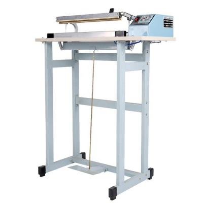 China DUOQI SFTD-600 220V 750W Iron Foot Pedal Heat Sealer Bag Sealing Machine with Knife for sale