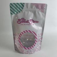China Custom printed stand up ziplock glossy finish mylar packaging bag with clear window for food grade candy for sale