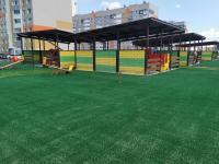 China Realistic Landscape Artificial Grass with 42mm Pile Height and Low Maintenance Ideal for Outdoor Gardens Patios and Leisure Zones for sale