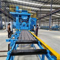 China Steel Bar Shot Blasting Machine with Adjustable Speed Roller Conveyor, Wear-Resistant Manganese Steel Liner, and High-Performance Cartridge Dust Collector for sale