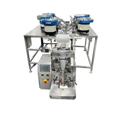 China Vibration Disk Vertical Packaging Machine 260mm Film Width 220V 50Hz for Screws Nuts Fasteners for sale