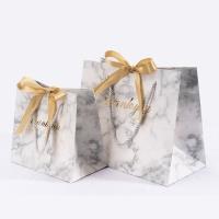 China Customized Sealing Handle Gift Bags with Bows for Clothing Jewelry and Gift Packaging for sale