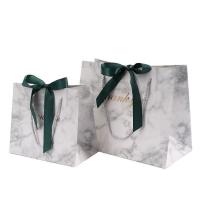 China Customized Sealing Handle Gift Bags with Bows for Clothing Jewelry and Gift Packaging for sale