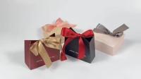 China Customized Sealing Handle Gift Bags with Bows for Clothing Jewelry and Gift Packaging for sale