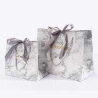 China Customized Sealing Handle Gift Bags with Bows for Clothing Jewelry and Gift Packaging for sale