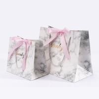 China Customized Sealing Handle Gift Bags with Bows for Clothing Jewelry and Gift Packaging for sale