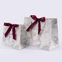 China Customized Sealing Handle Gift Bags with Bows for Clothing Jewelry and Gift Packaging for sale