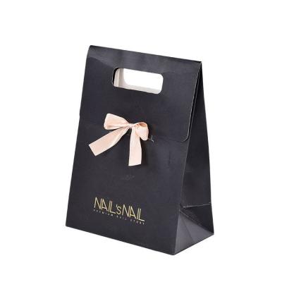 China Luxury Paper Gift Bags Packaging With Die Cut Handle And Logo for sale
