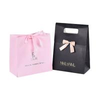 China Luxury Paper Gift Bags Packaging With Die Cut Handle And Logo for sale