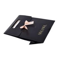 China Luxury Paper Gift Bags Packaging With Die Cut Handle And Logo for sale
