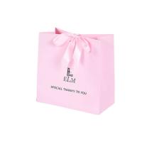 China Luxury Paper Gift Bags Packaging With Die Cut Handle And Logo for sale