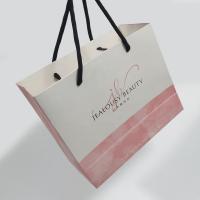 China Offset Printing Paper Gift Packaging Bags Luxury Cosmetic Clothes Gift Carry Bags for sale