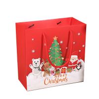 China Durable Christmas Paper Gift Bags Offset Printing Cardboard Packaging Bags for sale