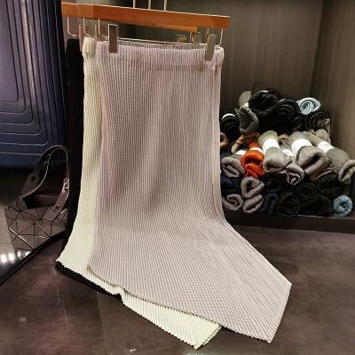 China Summer New Pleated Fish Scale Asymmetrical Skirt for Women Elegant Mid-Length Casual Style Natural Versatile Pure Color for sale