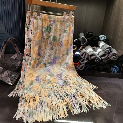China Women's Summer Vintage Half Skirt with Small Floral Design Pleated Tassel Mid-Length High-End Temperament Skirt for sale