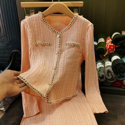 China Women's Spring Two-piece Set New Fashionable Bead Pleated High Waisted Skirt for sale
