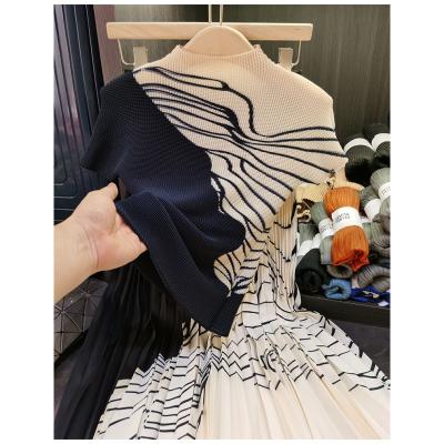 China Summer New Fashion Outfit Sanzhai Color Matching Corn Pleated Short Sleeves T-shirt Women's Pleated Skirt Two-piece Set for sale