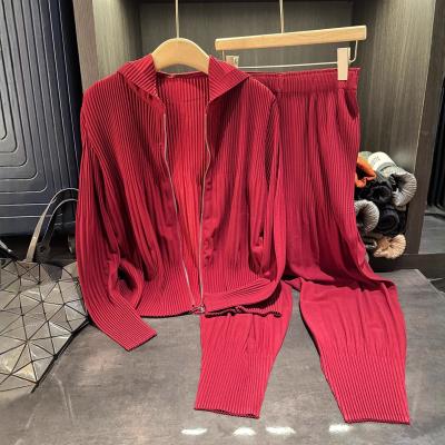 China Autumn Style Women's High-End Two-Piece Set Solid Color Zipper Hooded Pleated Suit Long Corduroy Large Size Harem Pants Button for sale