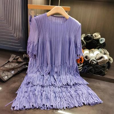 China Women's High-End Casual Two-Piece Short-Sleeved Tops and Pleated Tassel Skirts Solid Pattern New Summer Fashion Suit for sale