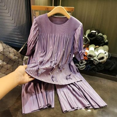 China Fashion suit top pants two-piece casual design solid color three-dimensional butterfly nail bead pleated suit for sale