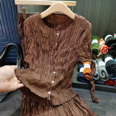 China Women's Casual Spring New Set High Waisted Pleated Skirt in Solid Color Two-Piece Design for sale