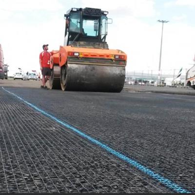 China Highways / Railways / Airports Fiberglass Geotextile Geogrid Bitumen Coated Glass Fiber Geogrid for sale