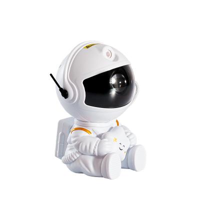 China New Astronaut Hug Star Galaxy Projector Night Light 360 Degree Adjustable Spaceman Starry Sky Projector Light Atmosphere for sale
