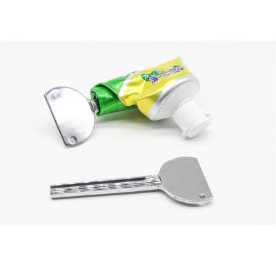 China skin care production saver logo customized private label metal key squeezer for sale