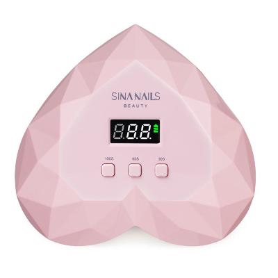 China Smart Heart Shape Dual Light Source 96w Professional Gel Nail Dryer UV LED for sale