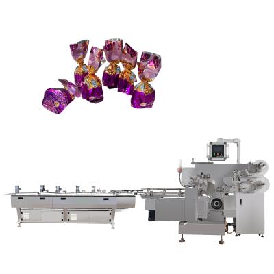 China Single Twisting Packing Style industrial chocolate packaging machine designed with wax paper wrapping material ensuring consistent packaging for sale