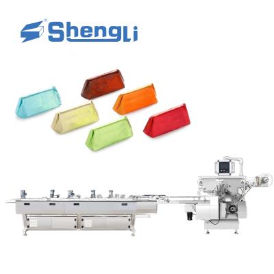China 220ppm-260ppm Triangle Chocolate Wrapping Machine Foil Paper Packaging Machine for sale
