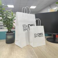 China Clothes Paper Shopping Bag Customized Logo Kraft Paper Shopping Bags White Brown Twisted Handle Eco Friendly Printing Paper Bags for sale