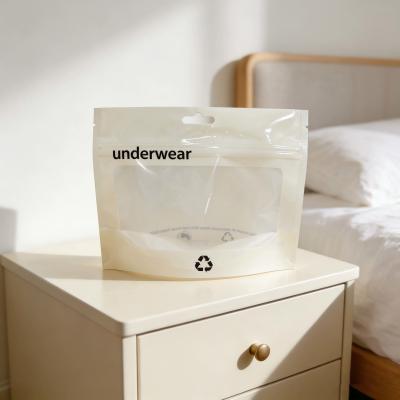 China Children's Clothing Environmentally Friendly Degradable Customized Logo Apparel Packaging Plastic Bag for T-shirt Underwear Socks for sale