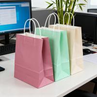 China Service Provided Flexible Surface Handling Flexo Printing Customized Brown Kraft Paper Bags with Logo Handles Recyclable Degradable for sale