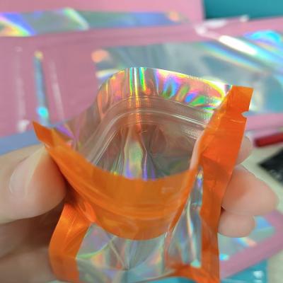 China LDPE Plastic 18x26 Shiny Holographic Plastic Bag Transparent Window YinYang Self sealing Zipper Pouch Gravure Printing for sale