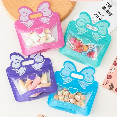 China PET Plastic Custom Printing Self Supporting Packaging Bow High End Children Gift Bag Biodegradable Food Grade Mylar Bag for sale
