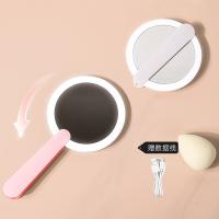China Effortlessly Beautiful Portable Foldable Handheld LED Makeup Mirror with UV Printing for sale