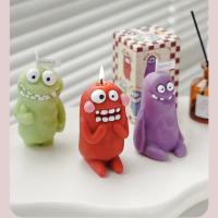 China Hotel and Resort Target End User Clay Man Monster Candle for Funny Year Fragrance Gift for sale