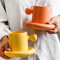 China Exquisite Nordic Candy Egg Handle Ceramic Cup and Plate Set for Company Employee Gift for sale