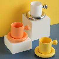 China Exquisite Nordic Candy Egg Handle Ceramic Cup and Plate Set for Company Employee Gift for sale