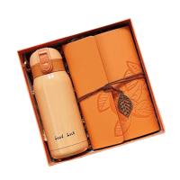 China Customized Color Orange Fashion Entry Gift with Hand Warm Cup Notebook Good Luck Pendant for sale