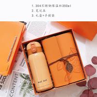 China Customized Color Orange Fashion Entry Gift with Hand Warm Cup Notebook Good Luck Pendant for sale