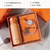 China Customized Color Orange Fashion Entry Gift with Hand Warm Cup Notebook Good Luck Pendant for sale